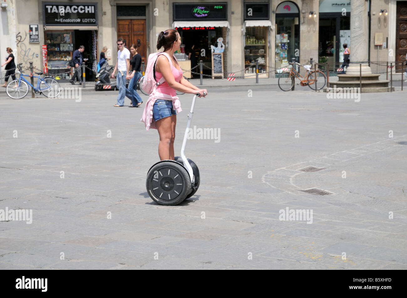 Woman riding Segway motorised vehicle Stock Photo - Alamy