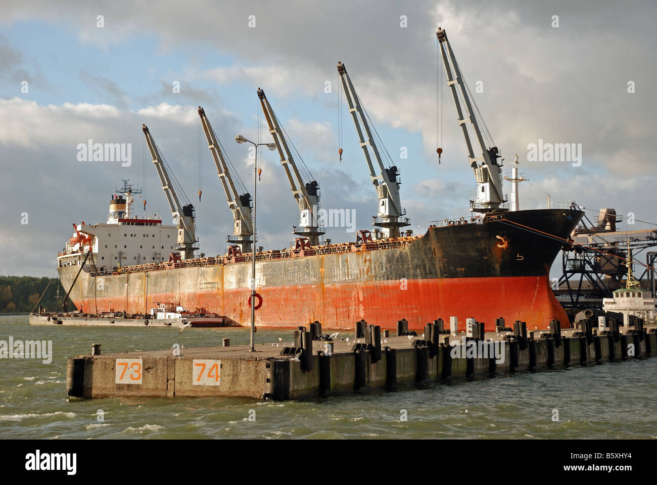 The cargo ship under loading in sea port Klaipeda Lithuania Stock Photo ...