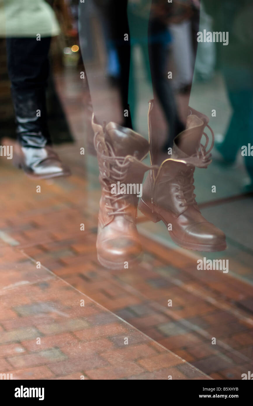 Brighton. Untied boots in shop window Stock Photo - Alamy
