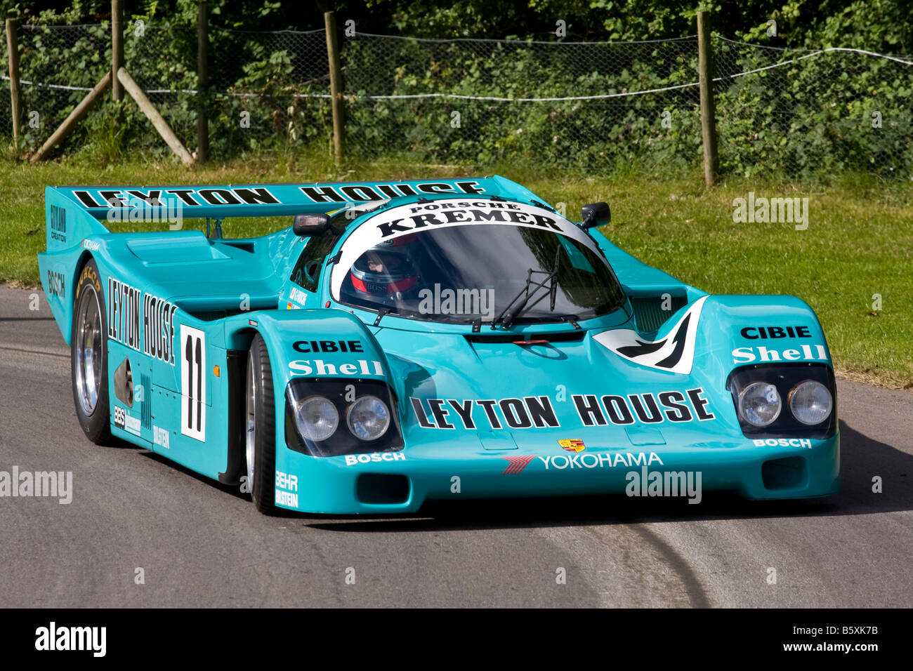 1987 Porsche 962 Le Mans racer with driver John Watson at Goodwood ...