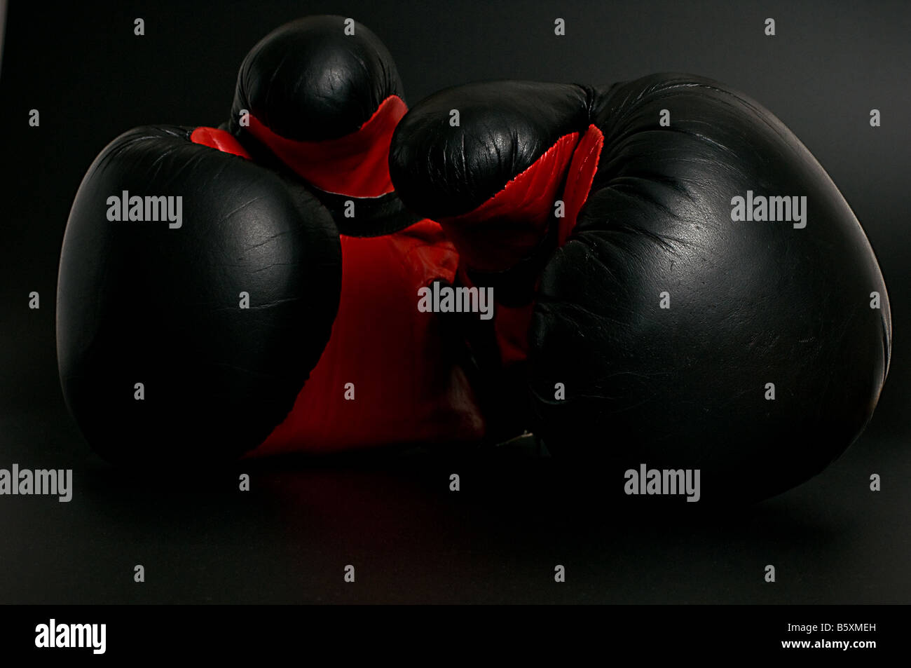 A pair of black and red boxing gloves on a dark background Stock Photo ...