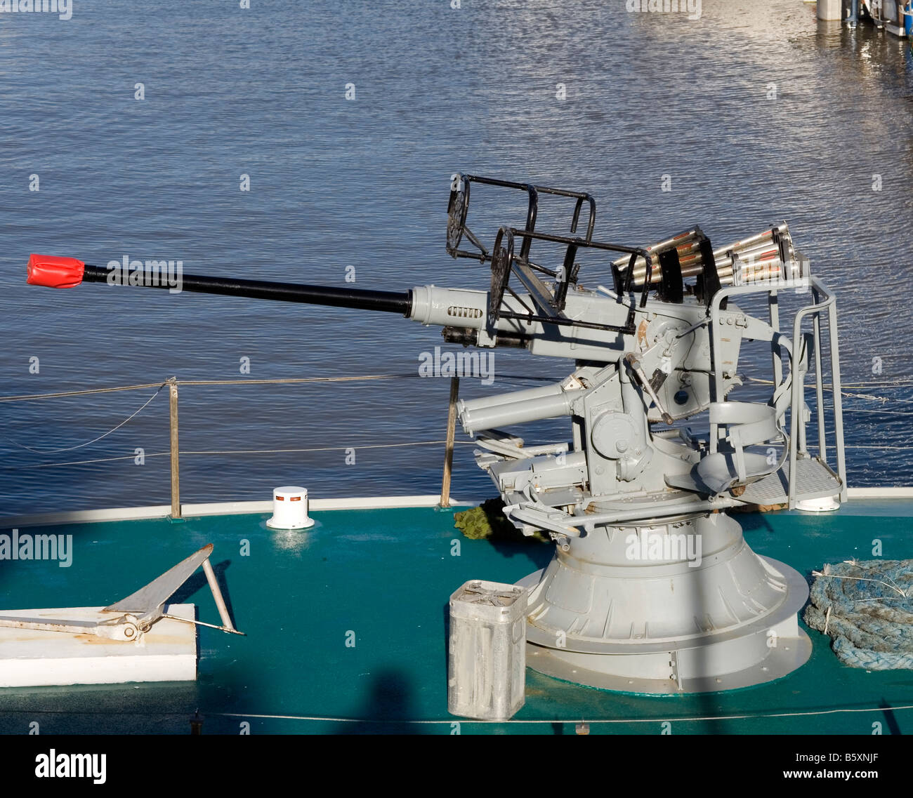 a gun on a naval warship Stock Photo - Alamy