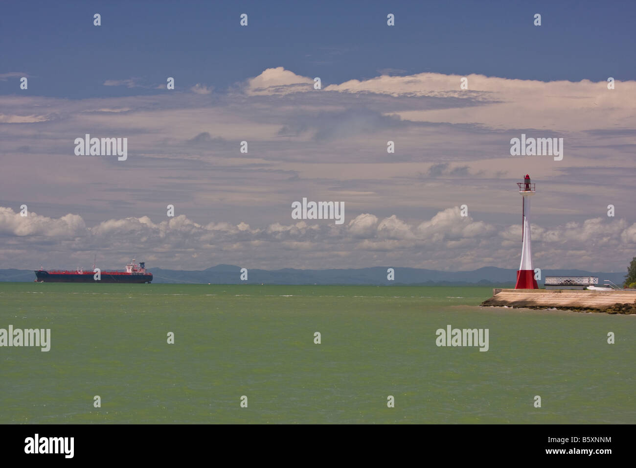 BELIZE CITY BELIZE Oil tanker near Fort George lighthouse in Belize ...