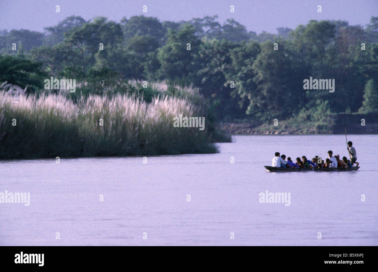 The only way of crossing Royal Chitwan National Park s Rapti River is ...