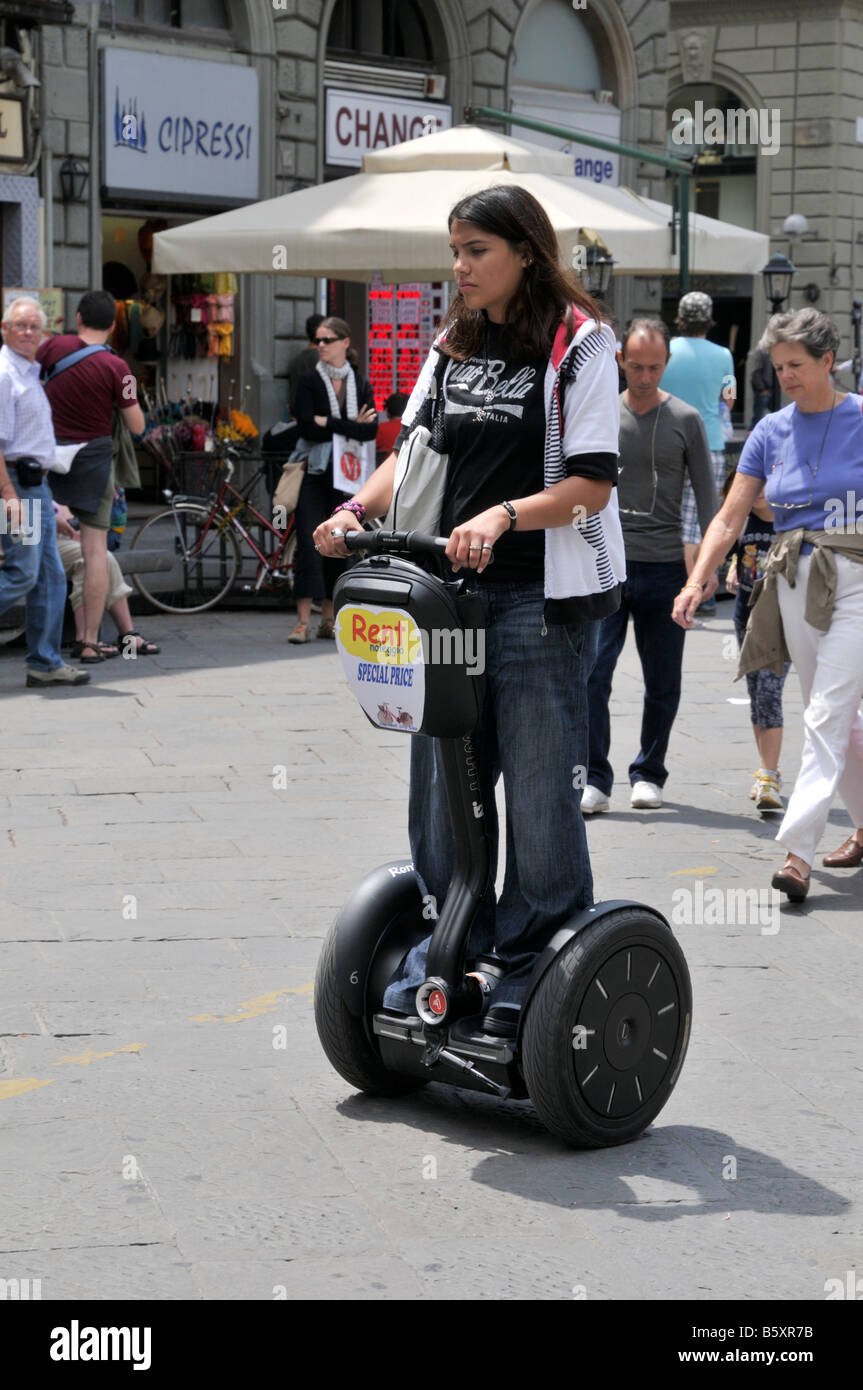 Woman riding Segway motorised vehicle Stock Photo - Alamy