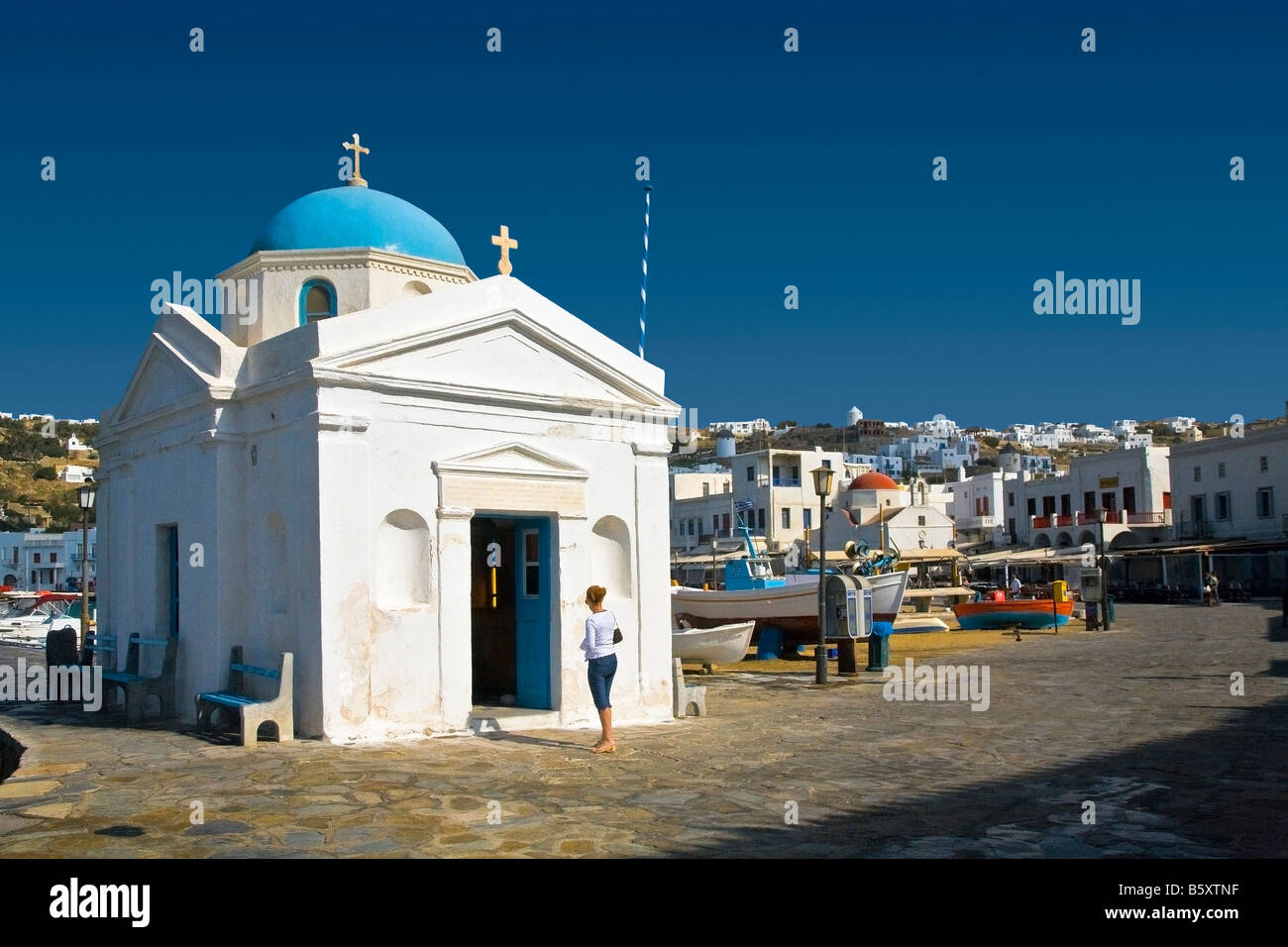 Small traditional white church with a blue dome in Mykonos, Greece ...