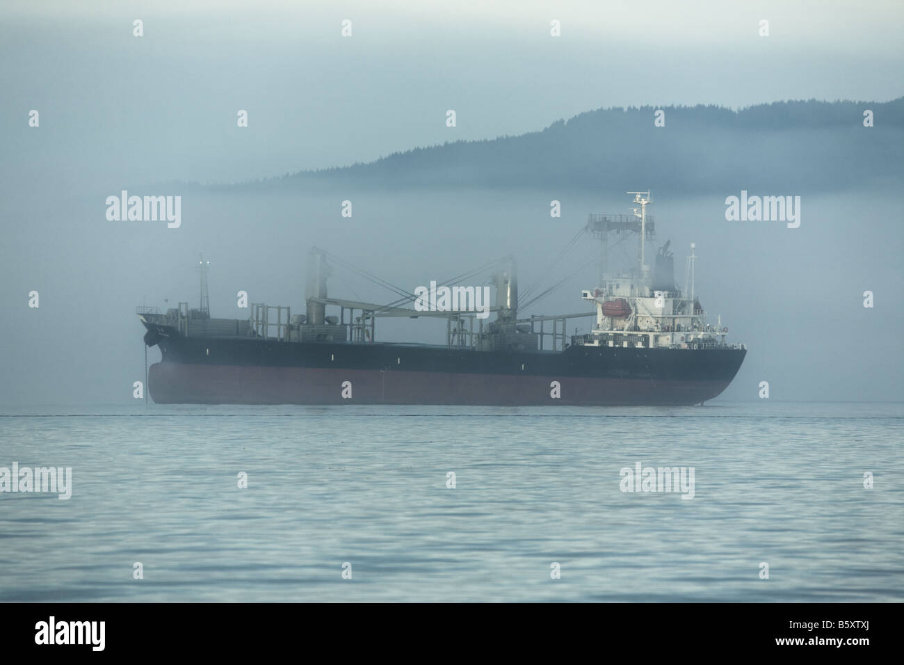 cargo ship in the fog Stock Photo - Alamy