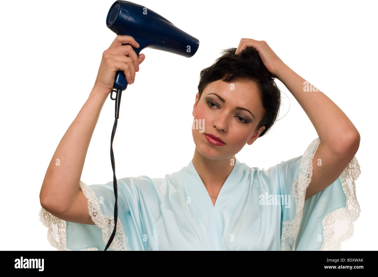 woman fixing hair Stock Photo - Alamy