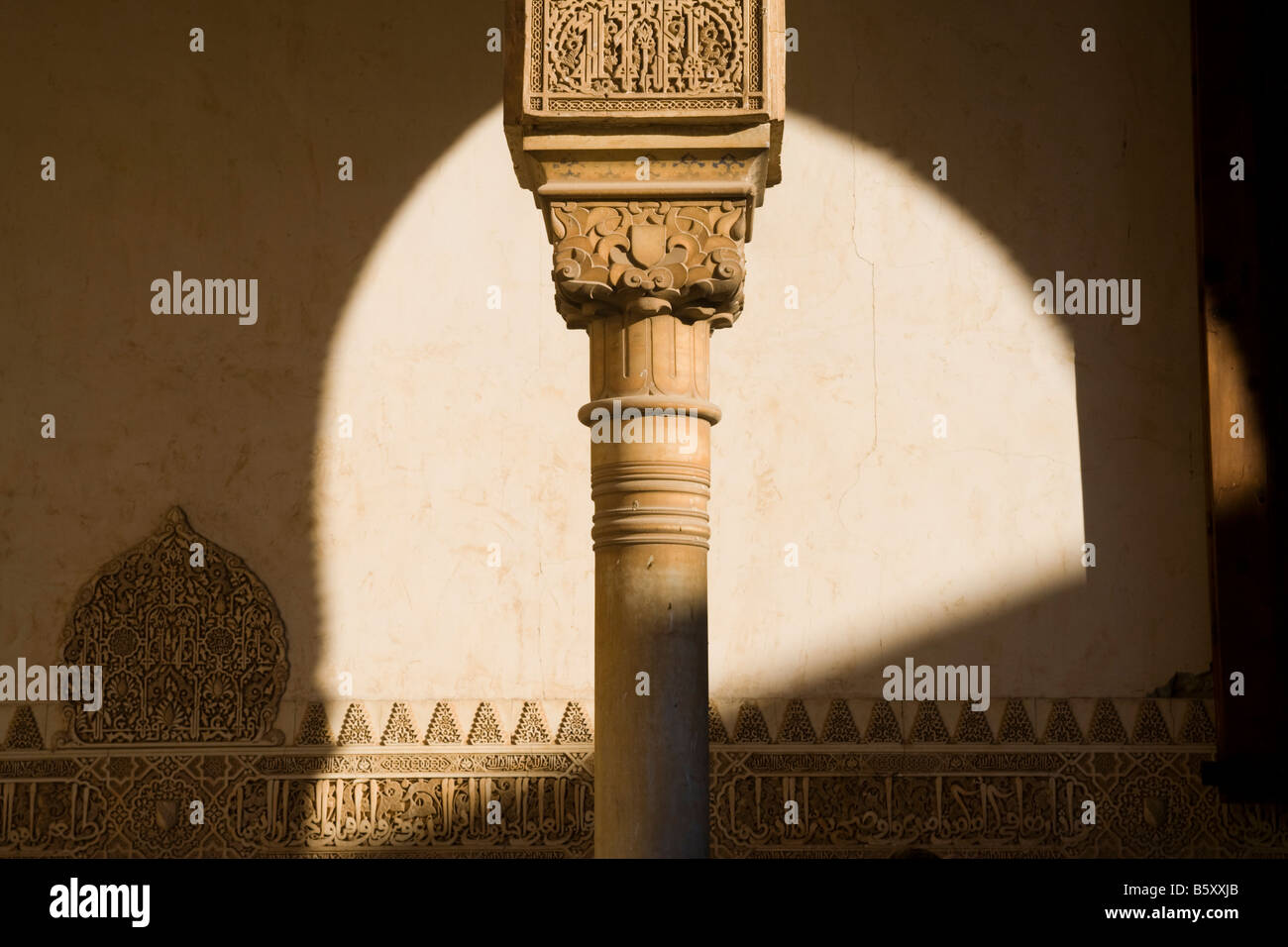 Carved stucco arabesques adorns a column capital in the Court of the ...