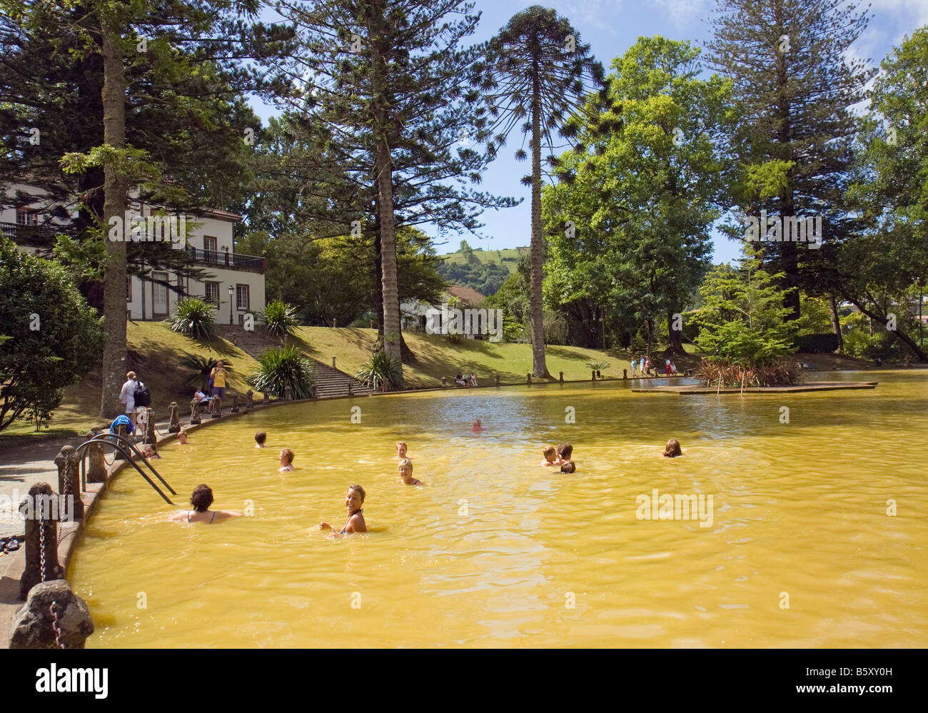People bathing in The Fountain of Youth, a hot spring in Terra Nostra ...