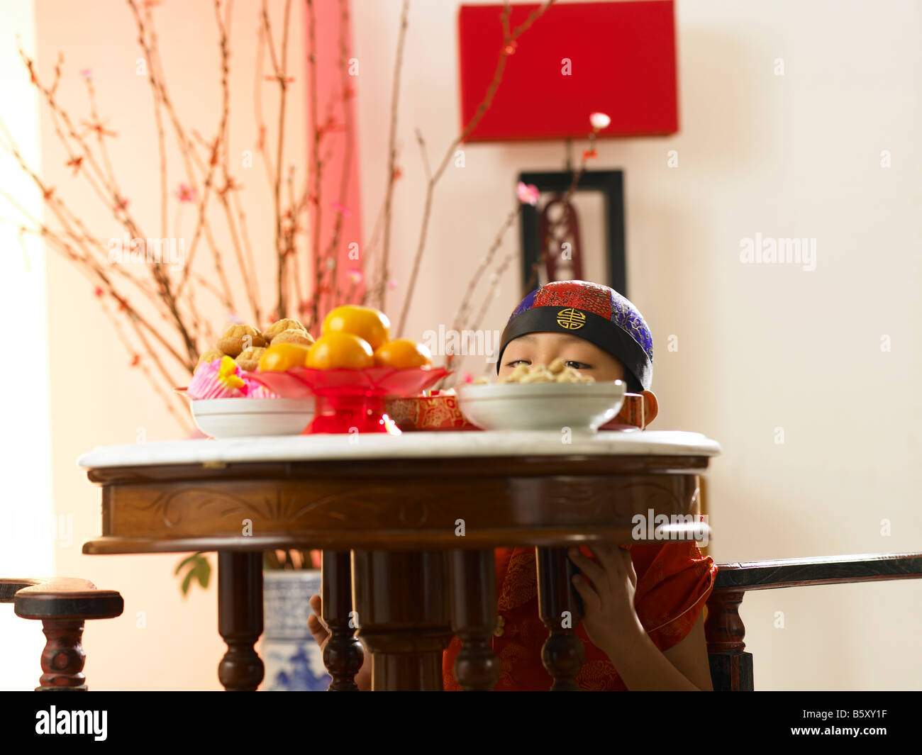 Boy peeking table hi-res stock photography and images - Alamy