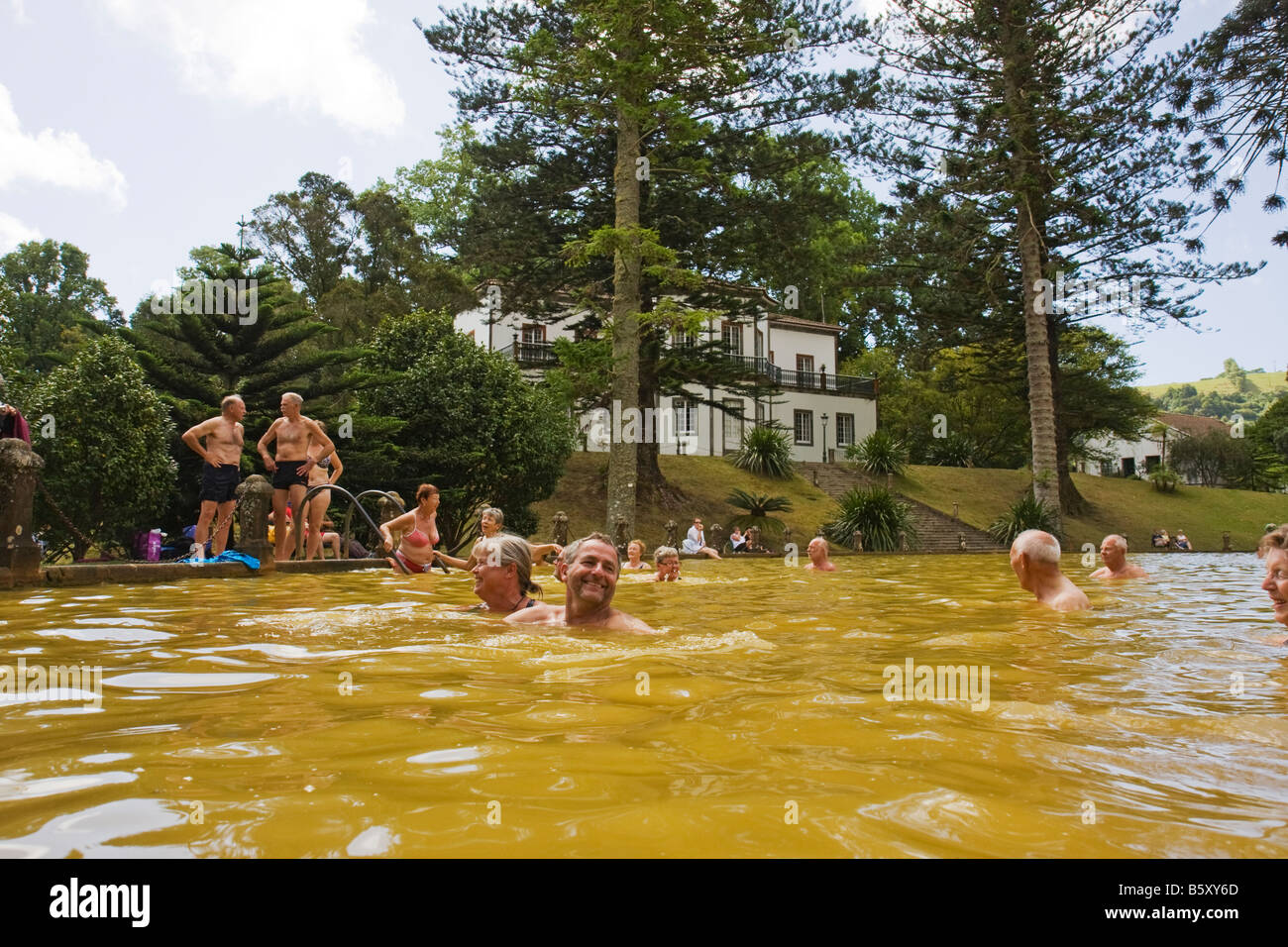People bathing in The Fountain of Youth, a hot spring in the Terra ...