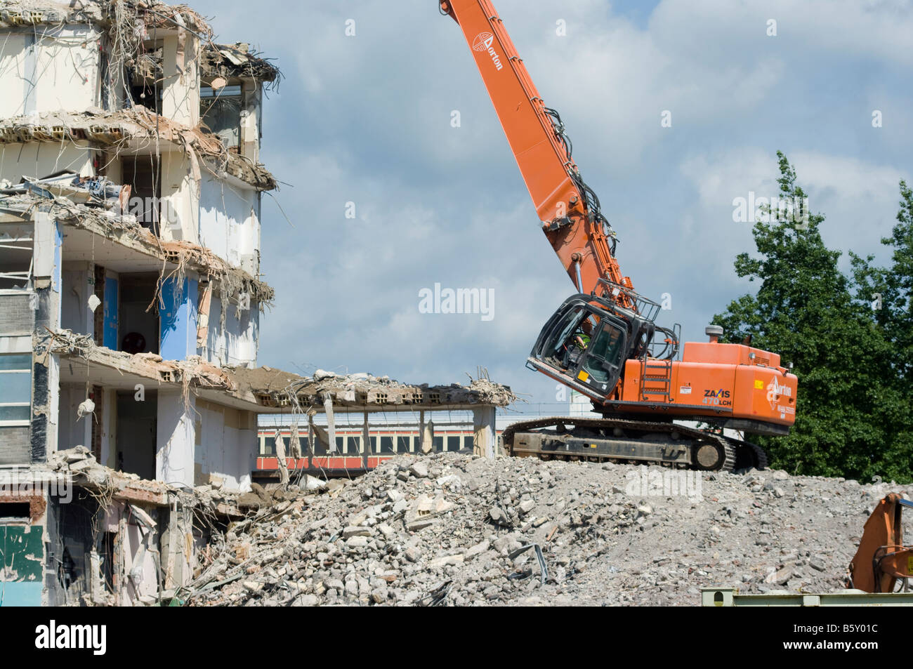 Daxis 470 LCH Demolition Vehicle demolishing building Site Stock Photo ...