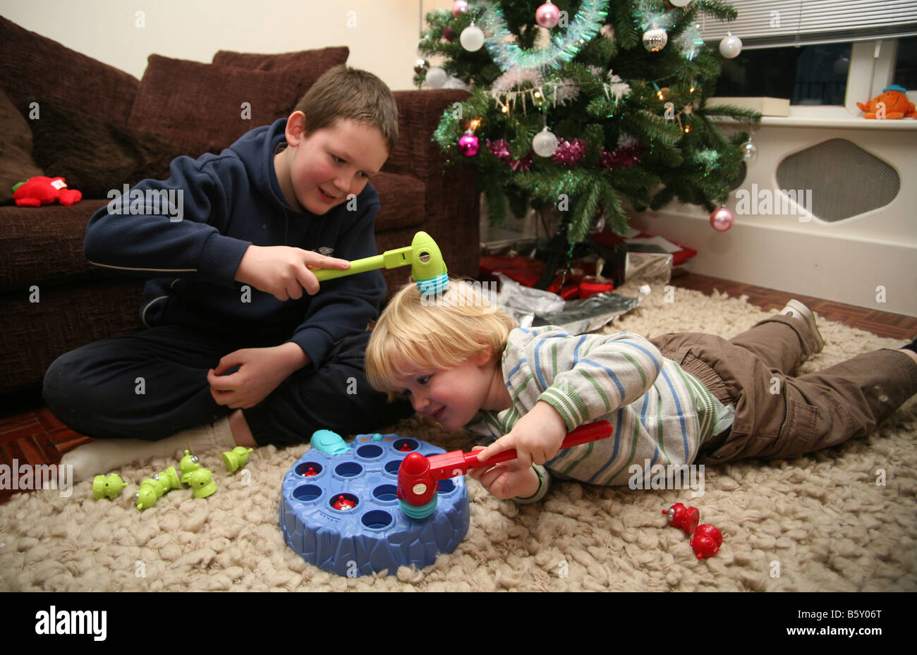Children arguing over toy hi-res stock photography and images - Alamy