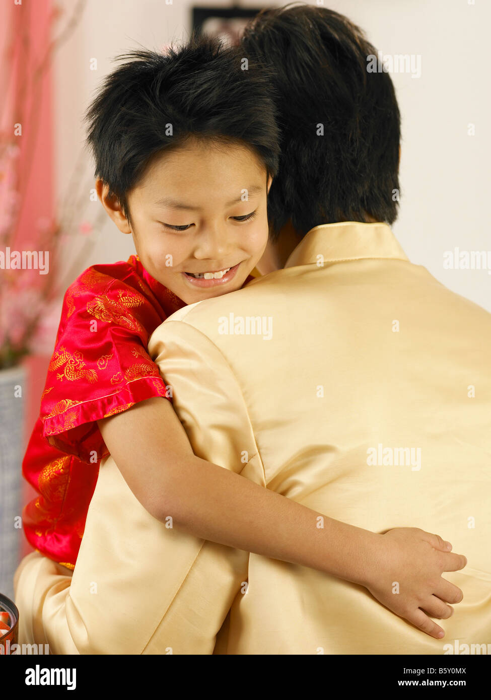 father embraces his son during chinese new year Stock Photo - Alamy