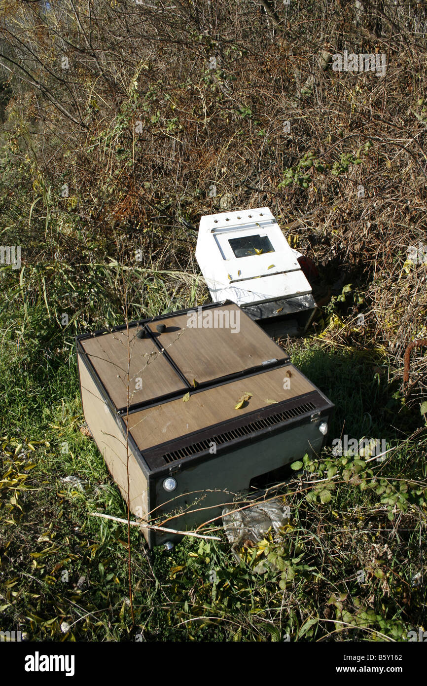 old oven and cupboard dumped in field in woods Stock Photo - Alamy