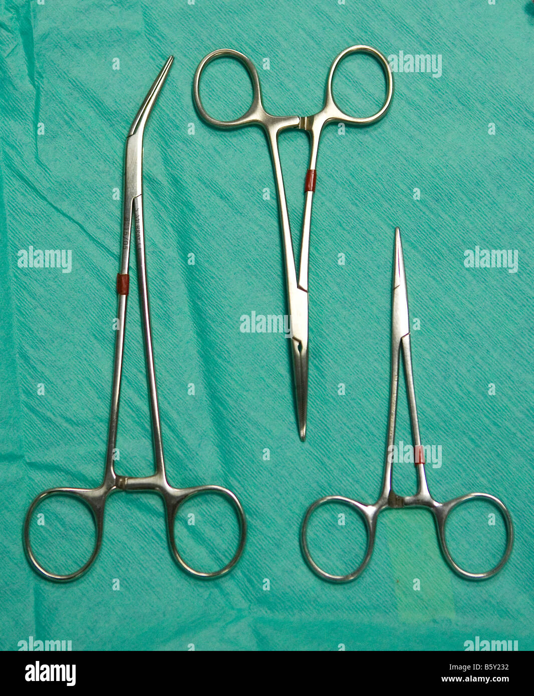 Forcep surgical instruments lie on a table in an NHS hospital in UK ...