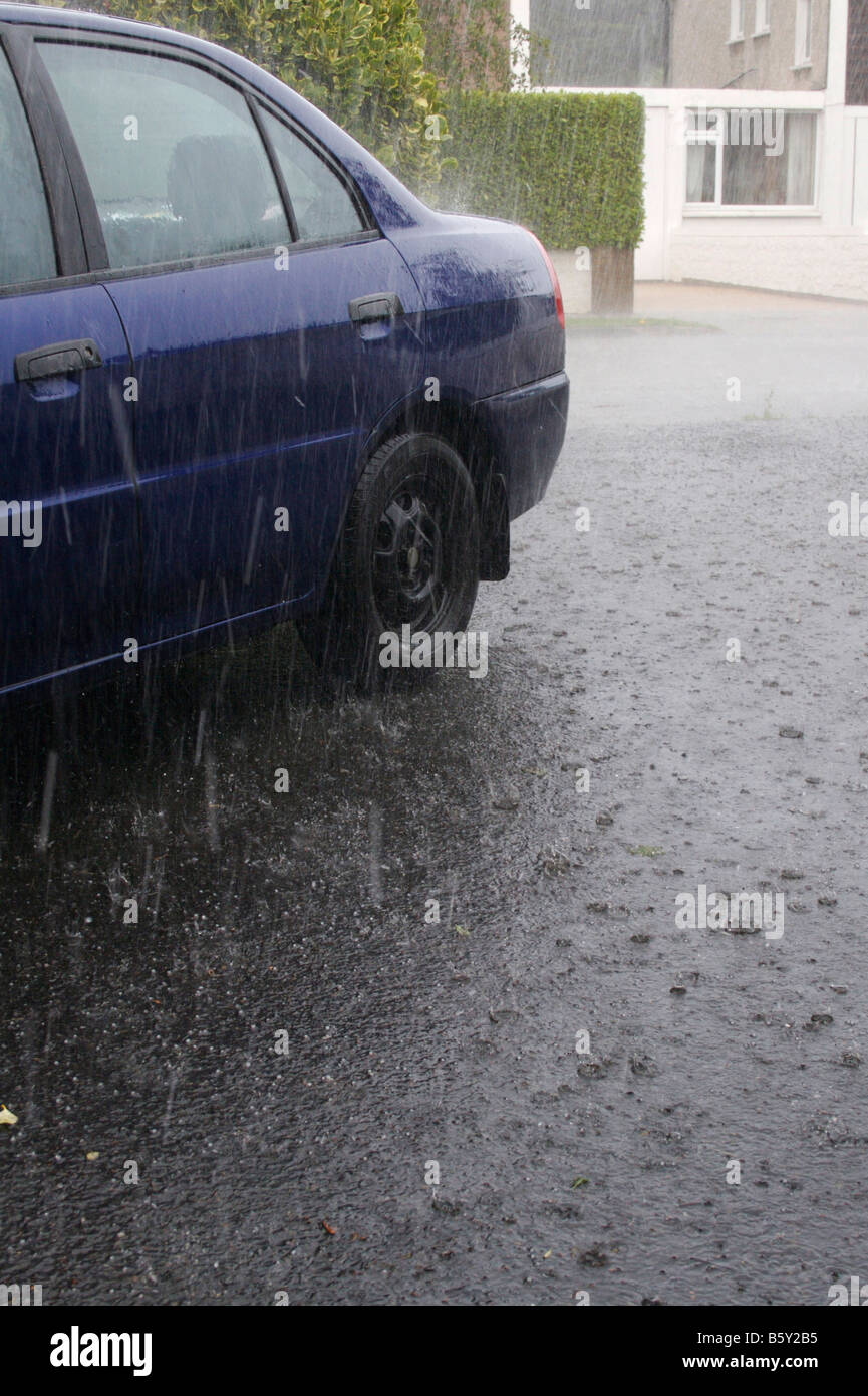 Heavy rain outside a house in Ireland blue car in the driveway Stock ...