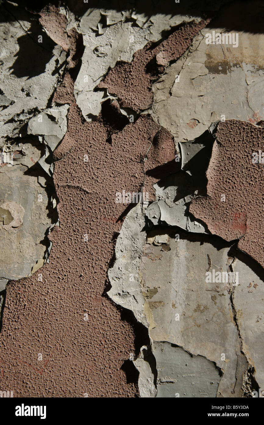 flaking paint on old dark brown wall surface Stock Photo - Alamy