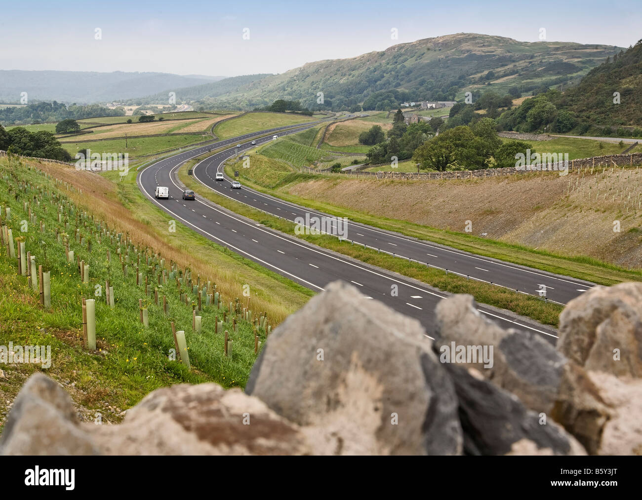 Drystone walling next to the A590 dual carriageway in Cumbria Stock ...