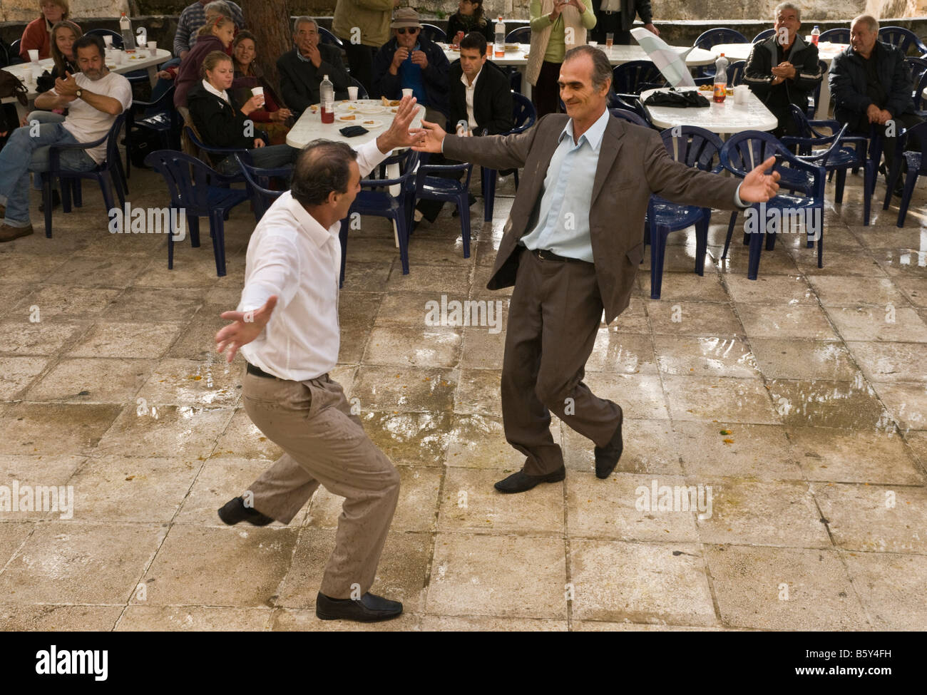 Greek men dancing at a Panayiri, a local festival. Proastio near ...