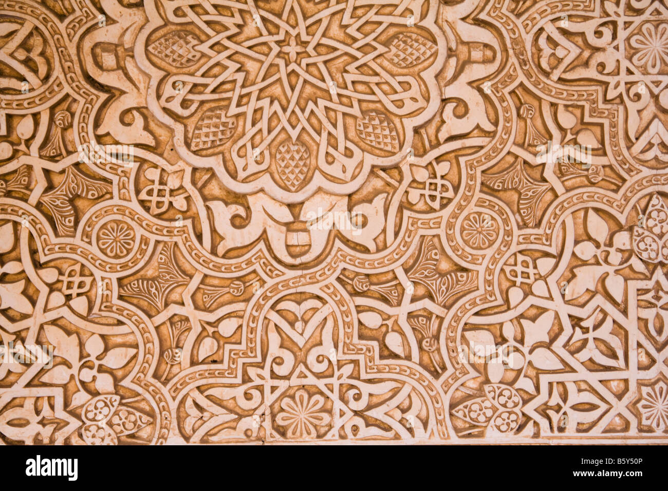 Close up of restored carved stucco arabesque plasterwork in the Casa ...