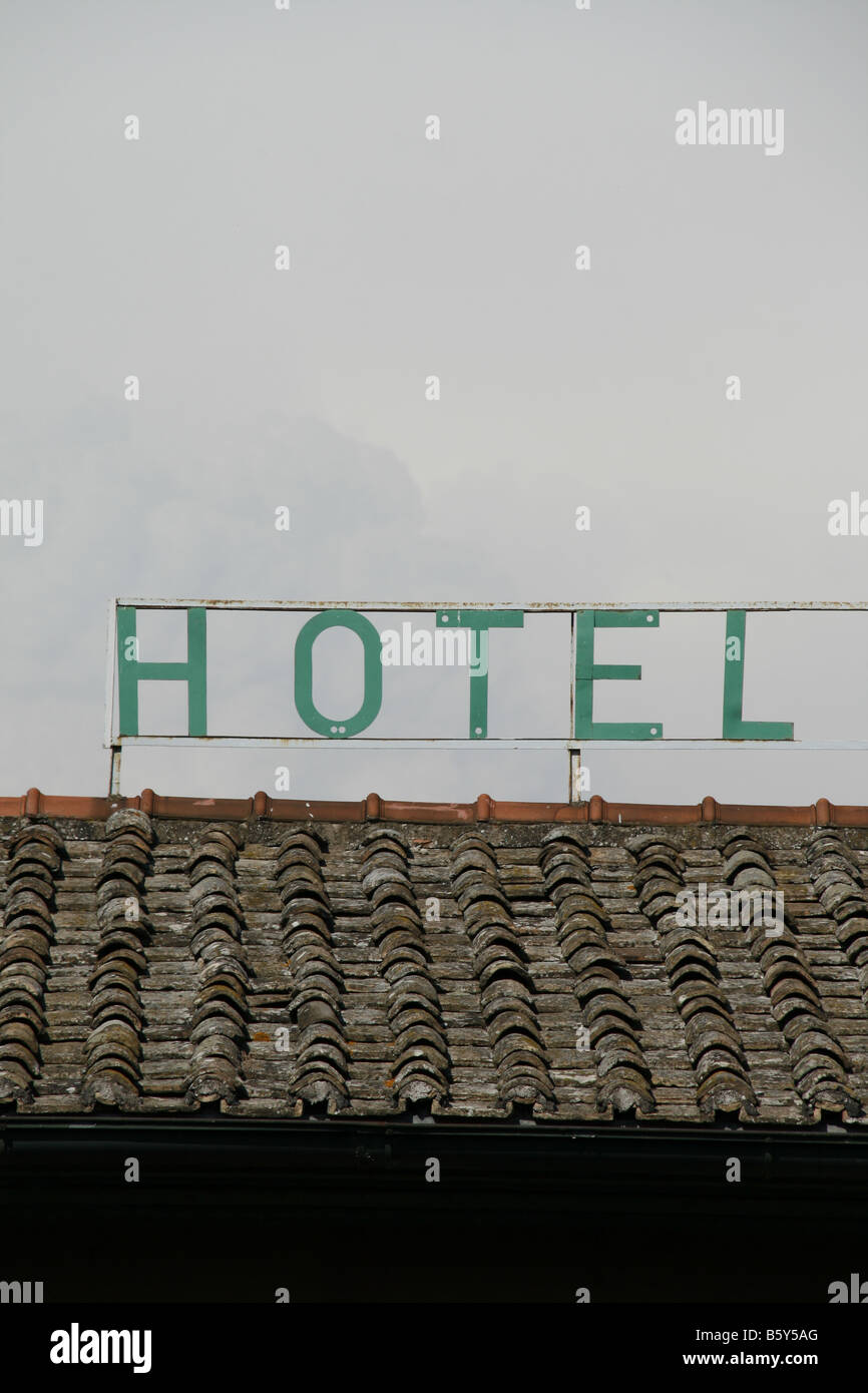 hotel sign on property roof top Stock Photo - Alamy