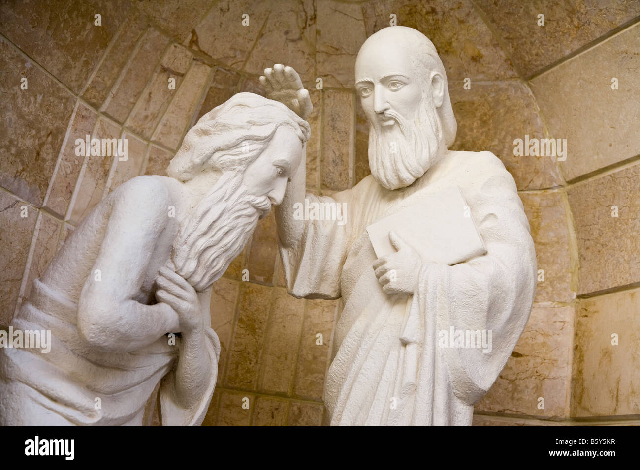 Statue of Ananias baptising Paul in the court yard of St Ananias. Old ...