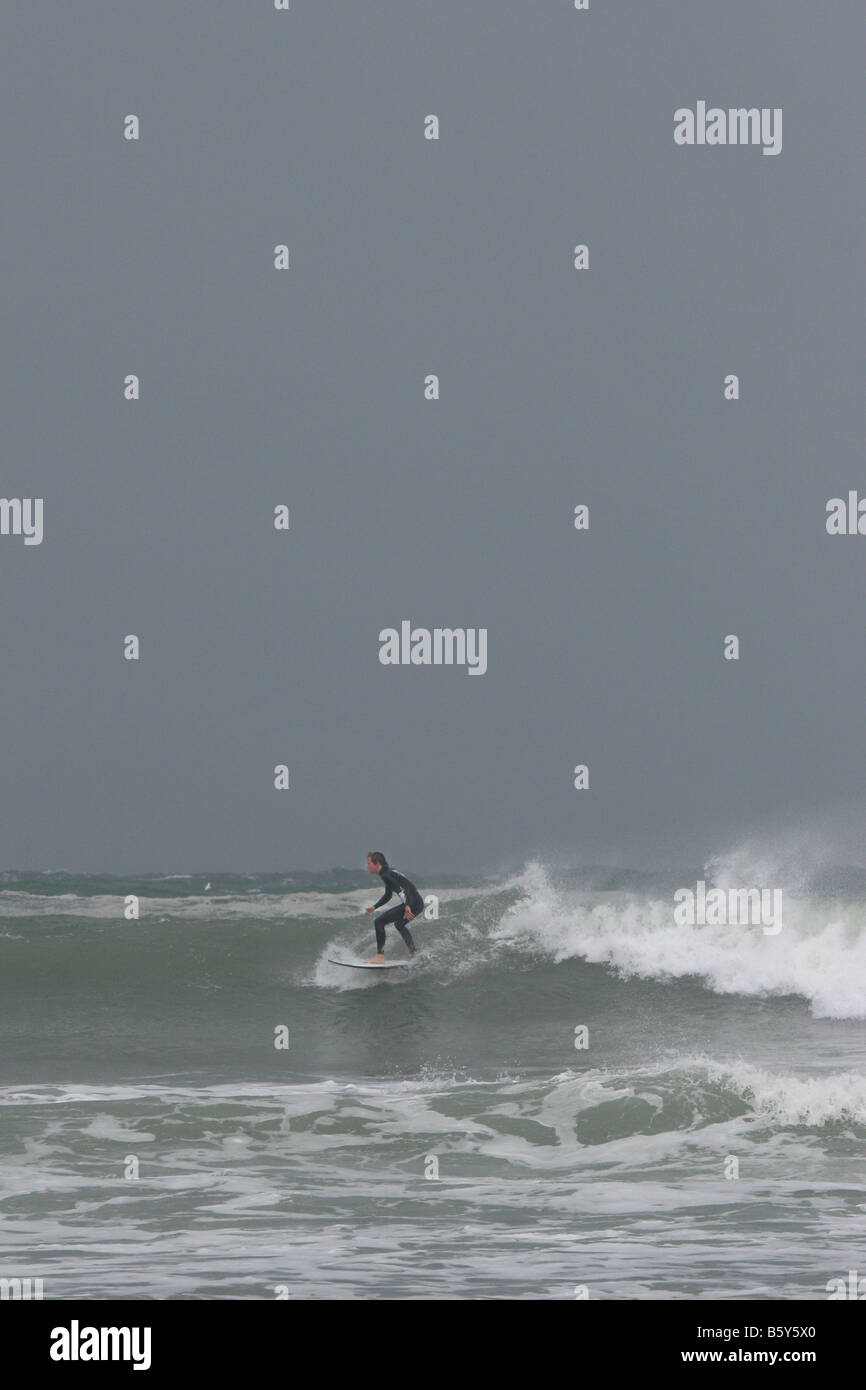 Surfer surfing waves at Towan Beach, Newquay, Cornwall, UK Stock Photo ...