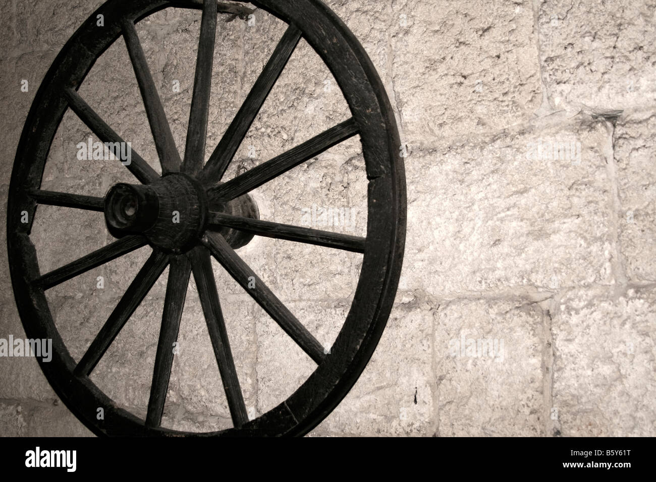 Vintage wooden wheel hanging on the wall. November, 2007, Budapest ...