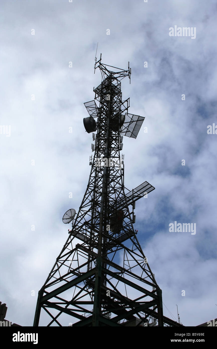 Older-style cell and communications tower Stock Photo - Alamy