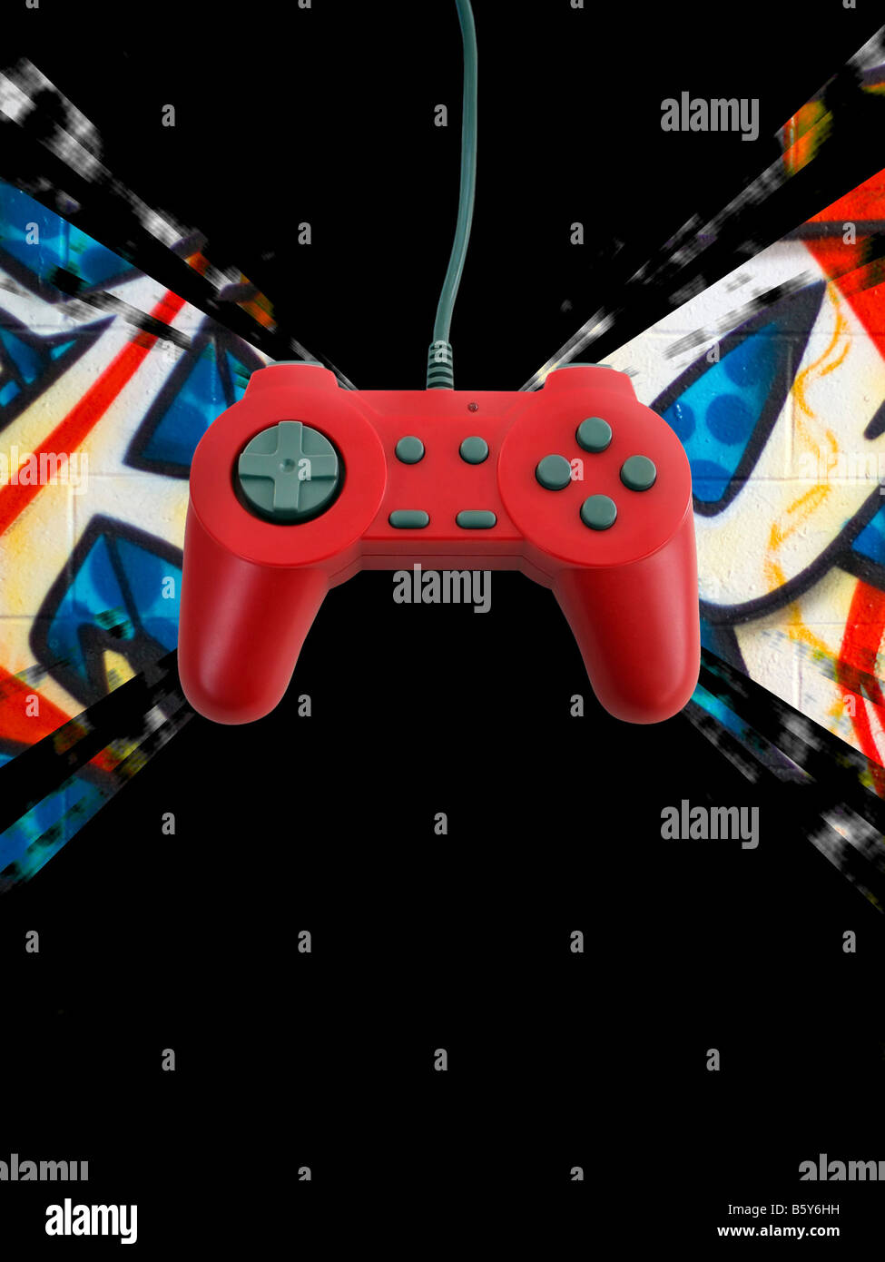 A red game controller over a graffiti background with plenty of copy ...