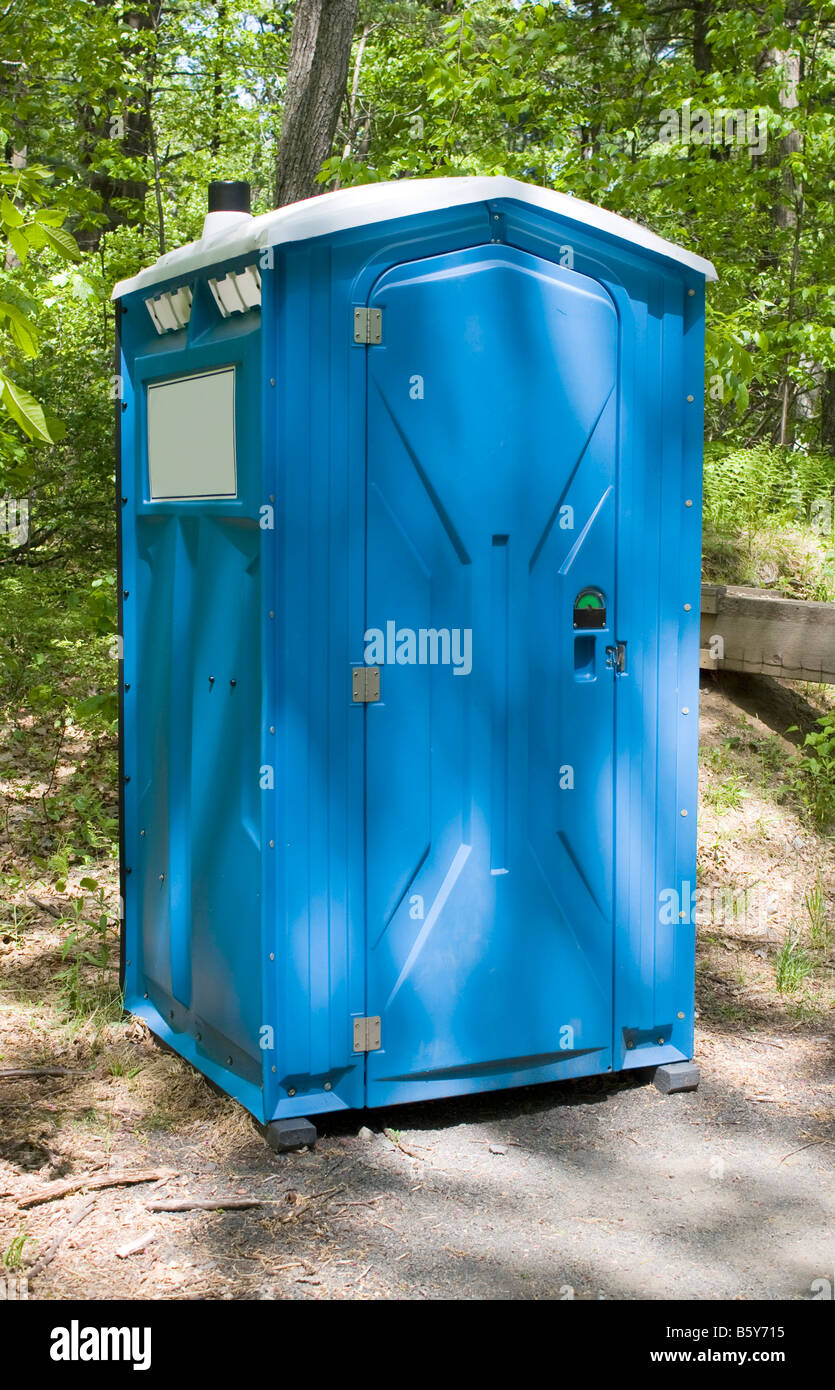 A blue porta potty located on the hiking trail Stock Photo - Alamy