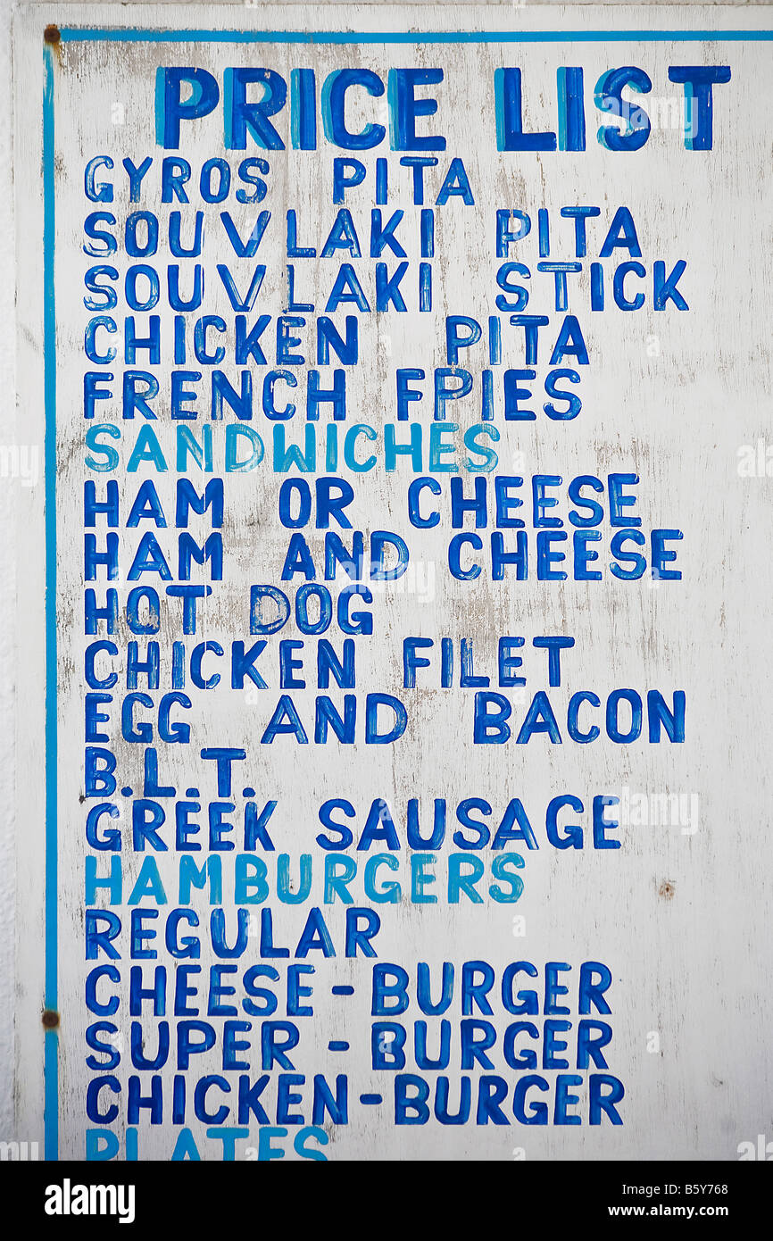 White sign with blue letters advertising the menu at a taverna in ...