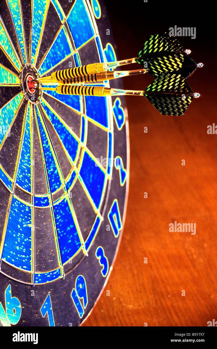 Three darts in center of dart board. Accuracy concept Stock Photo - Alamy