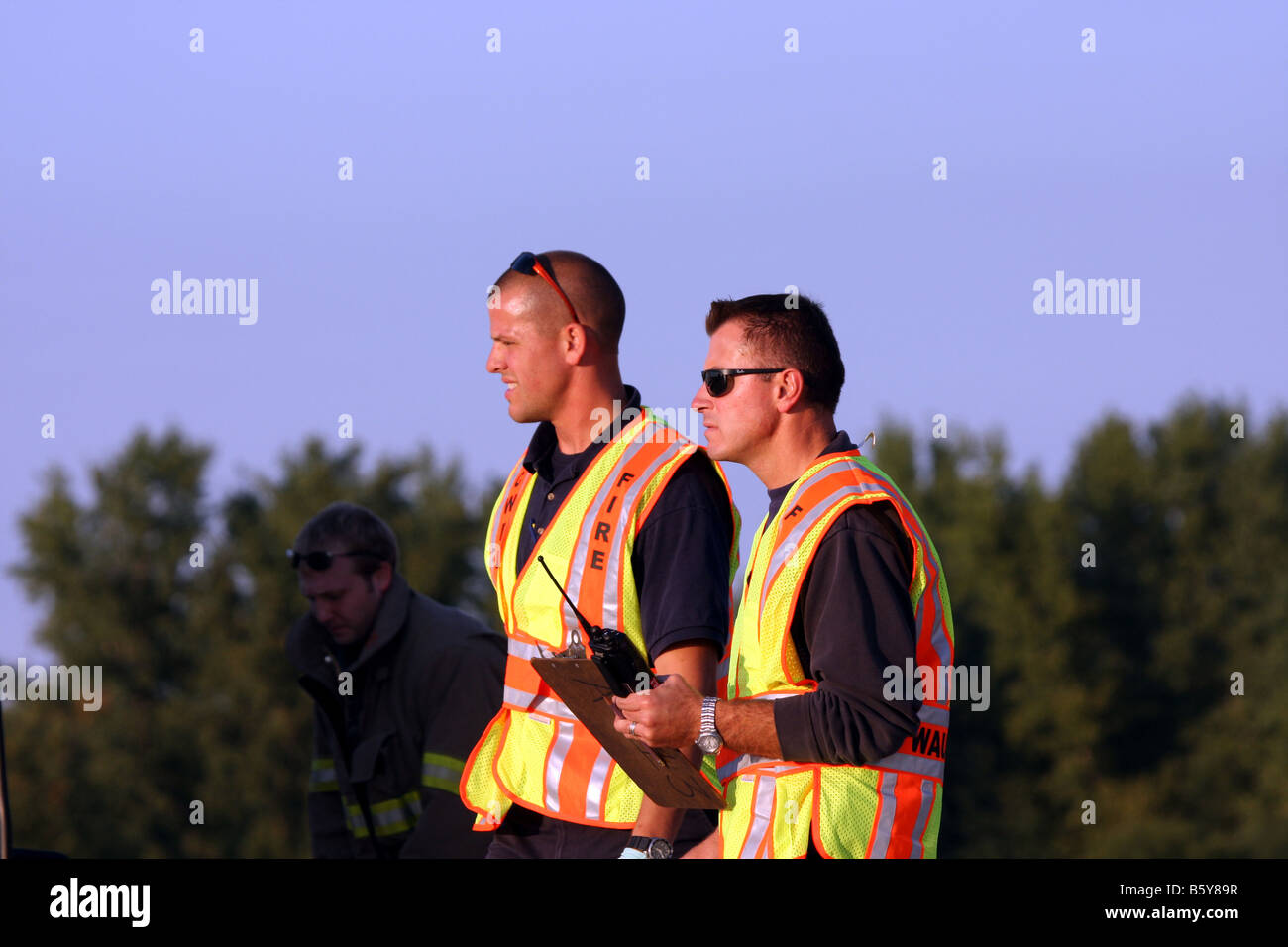 Three fire emts emergency medical personnel on a emergency scene Stock ...