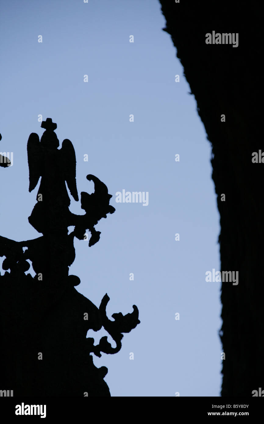 angel with cross on top of wrought iron gate in rome italy Stock Photo ...