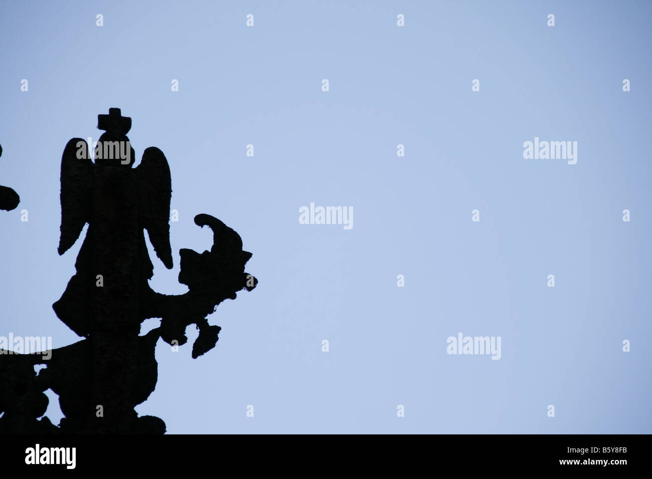 angel with cross on top of wrought iron gate in rome italy Stock Photo ...