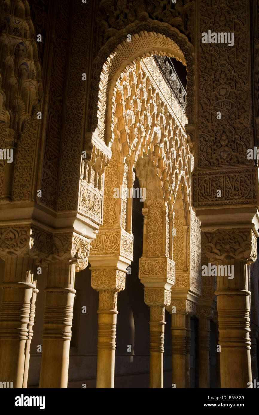 Carved stucco arabesques adorn the arches and columns of the Court of ...