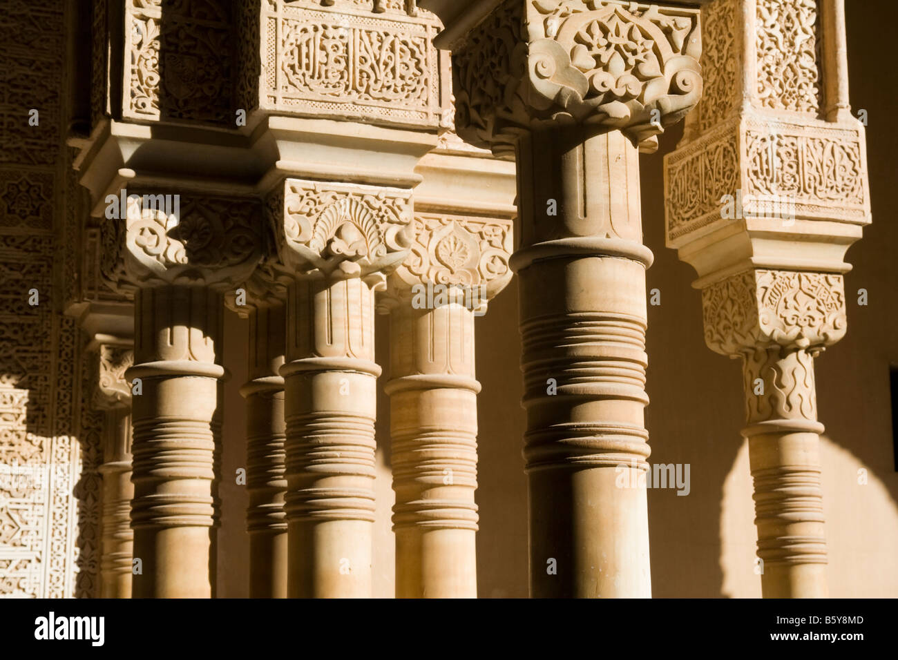 Carved stucco arabesques and Arabic scriptures adorn the column ...