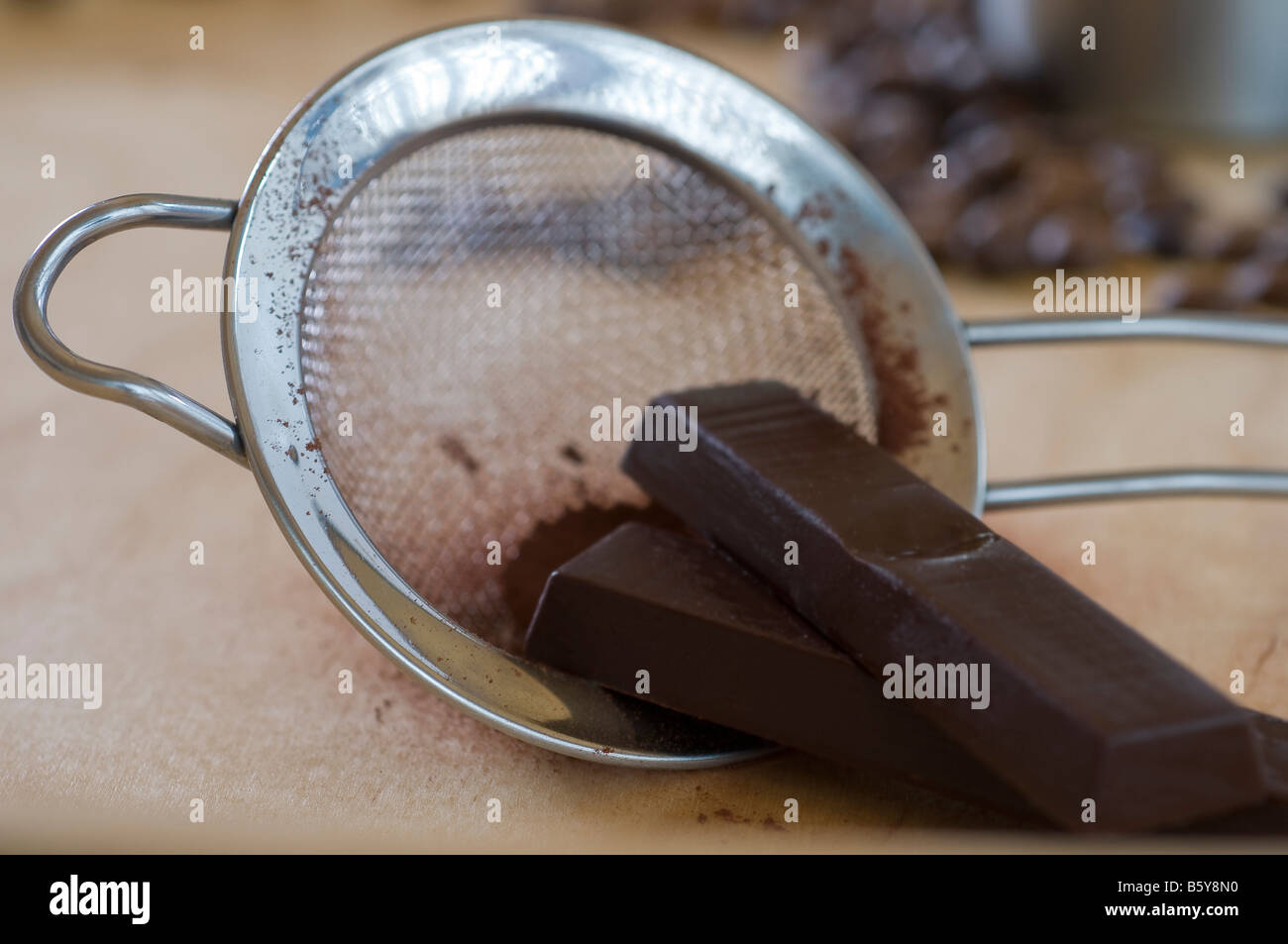 stainless steel filter with cocoa powder on wood Stock Photo - Alamy