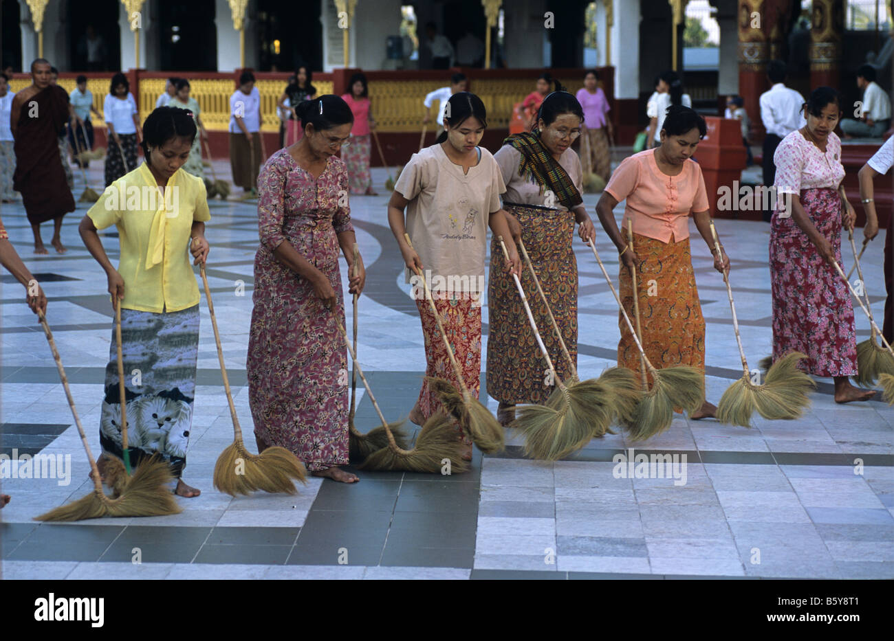 Burmese women ritual cleaning/sweeping at Shwedagon Paya, Burma's most ...
