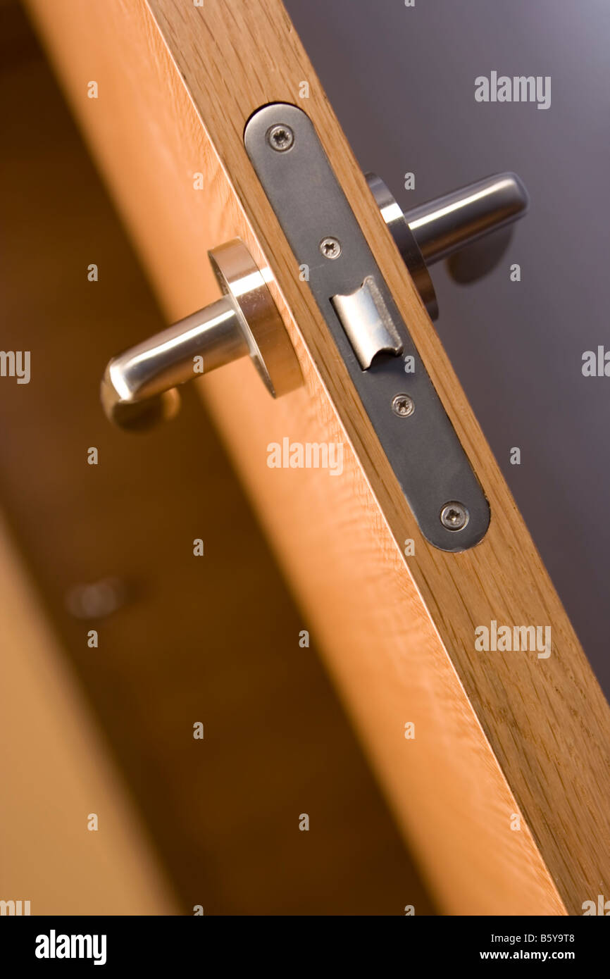 locked wood door and lock handle inside a house as a background Stock ...