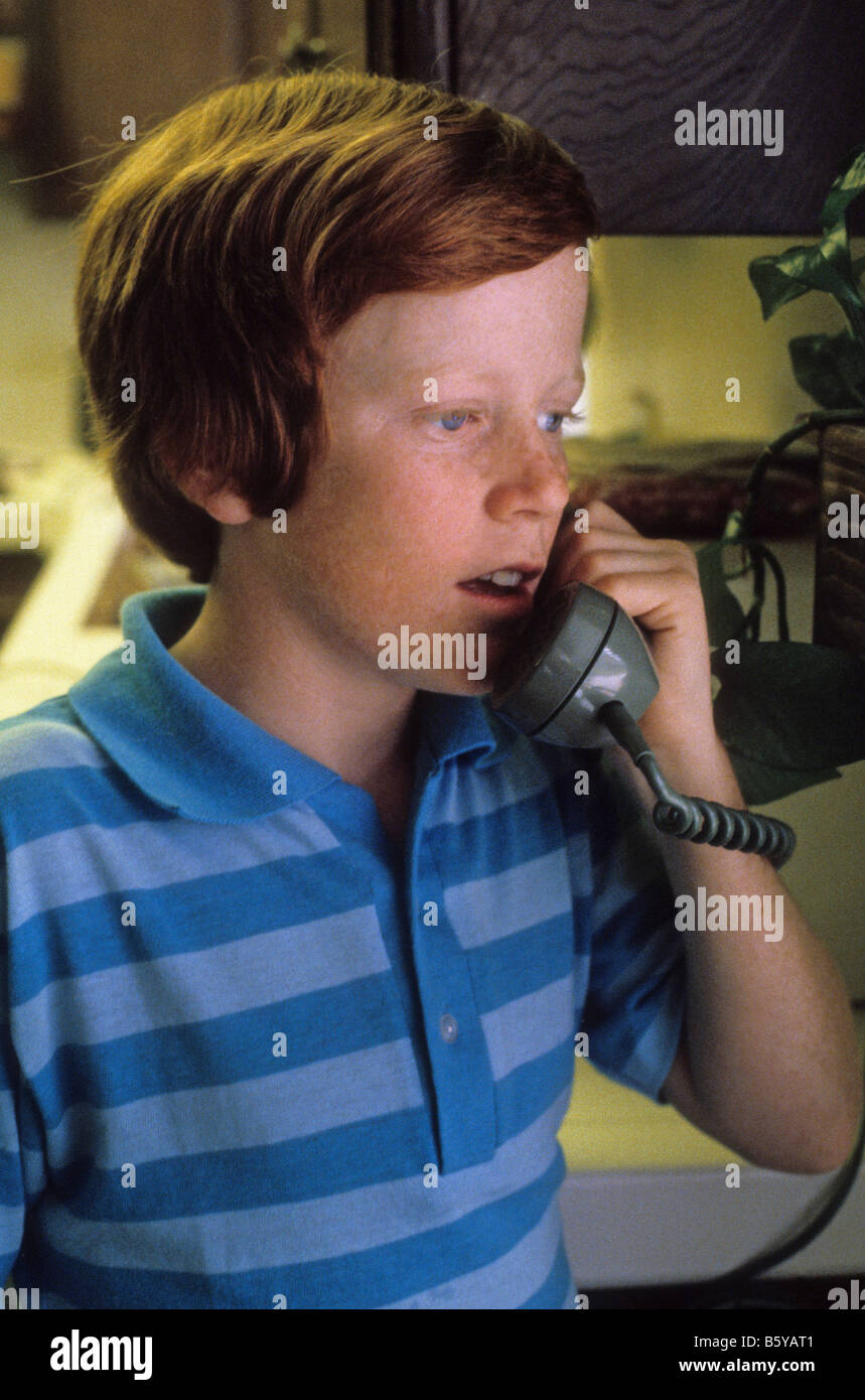 Boy makes telephone call Stock Photo - Alamy