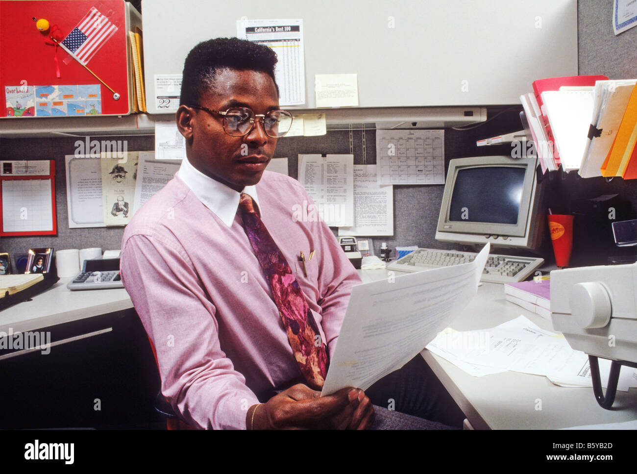 Black man works in his office Stock Photo - Alamy