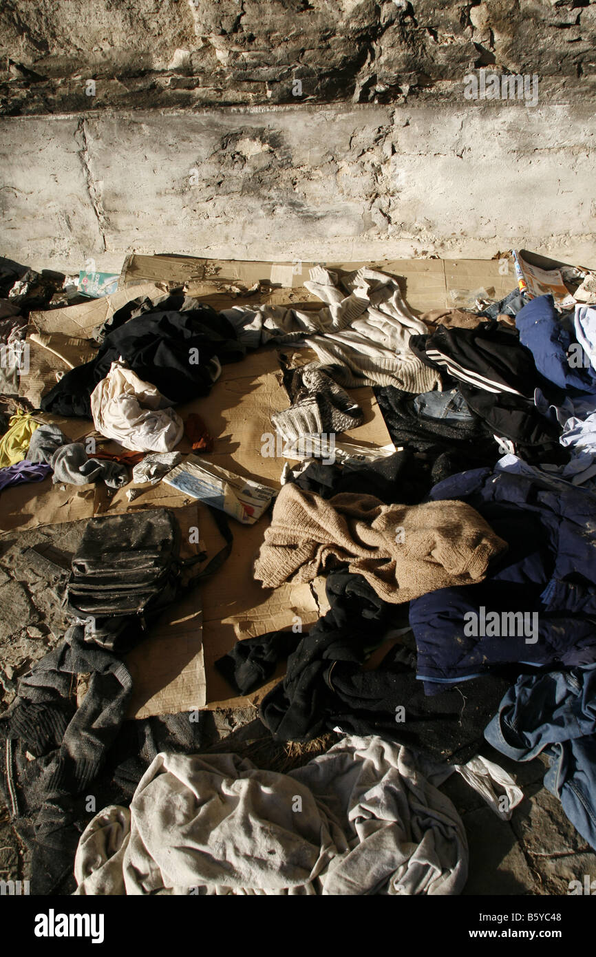 pile of old clothes garments left on street road Stock Photo - Alamy