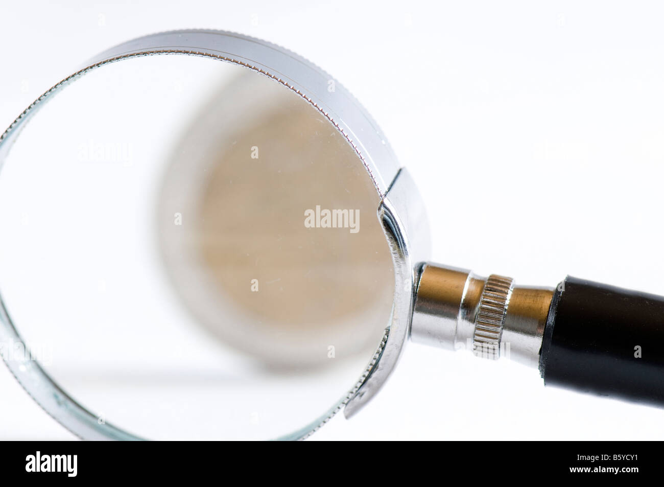 Economy under the microscope Stock Photo - Alamy