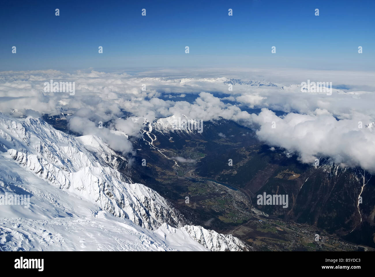 Spring valley Chamonix between high snow mountains occupied by light ...