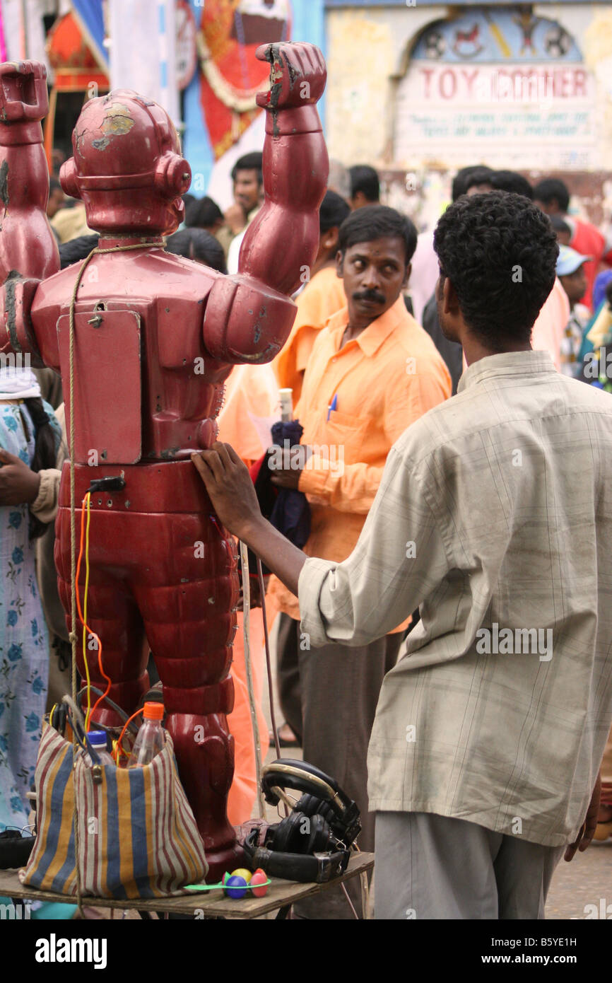A man operates a robot in Bangalore, India. The Robot tells the future ...