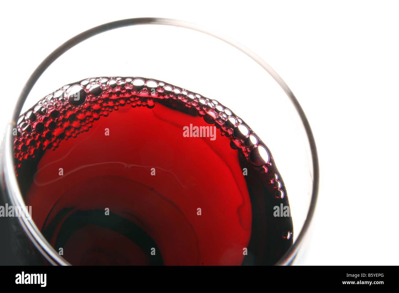 Glass of red wine view from above close up isolated over white ...